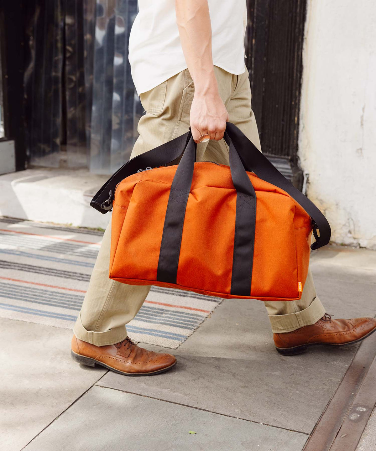 Minimalistic backpacks, tote bags, travel bags, and leather goods.